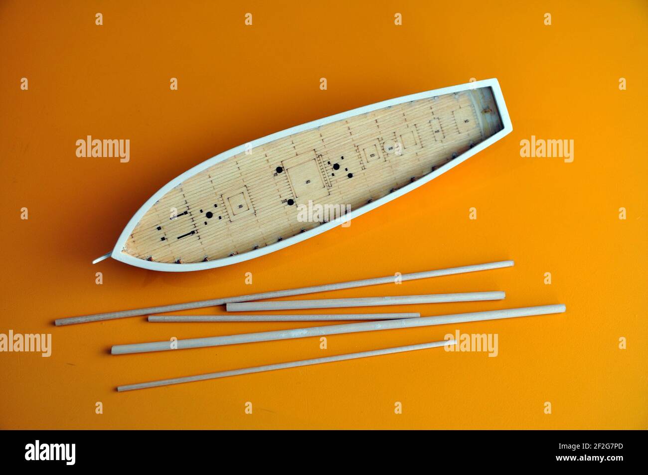 Making a model of a sailing ship, the hull of the ship on a yellow ...