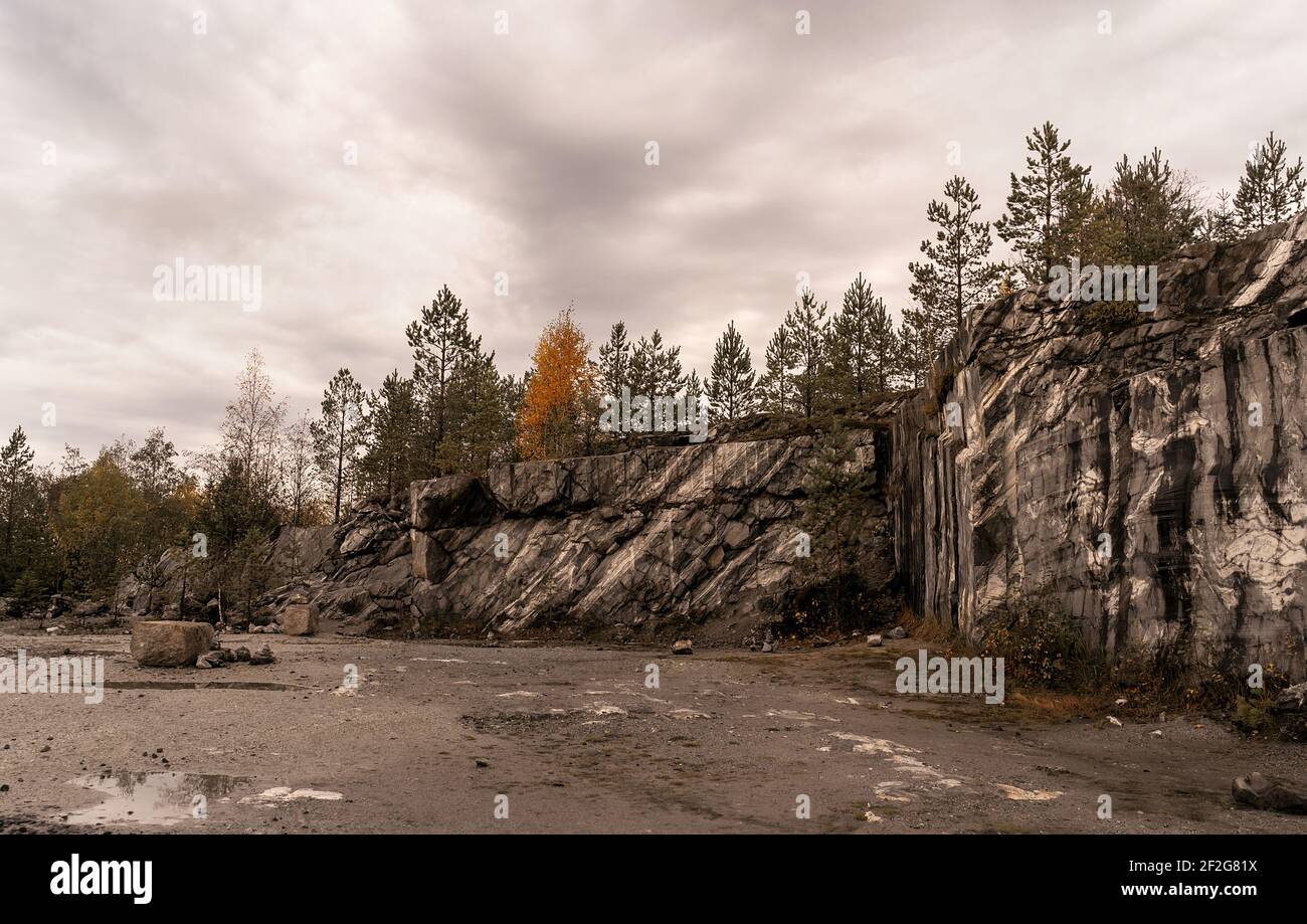 Picturesque natural park landscape with grey and white marble cliff and ...