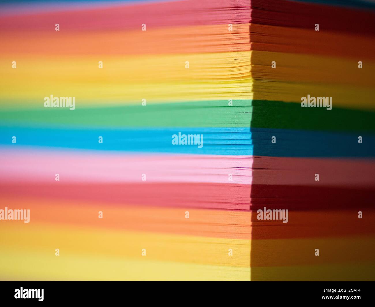 A selective focus shot of the row of colorful papers creating rainbow ...