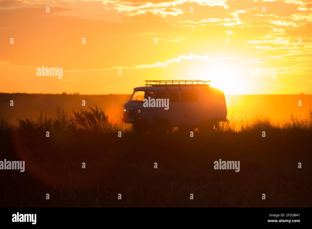 Driving along country road sunset hi-res stock photography and images ...