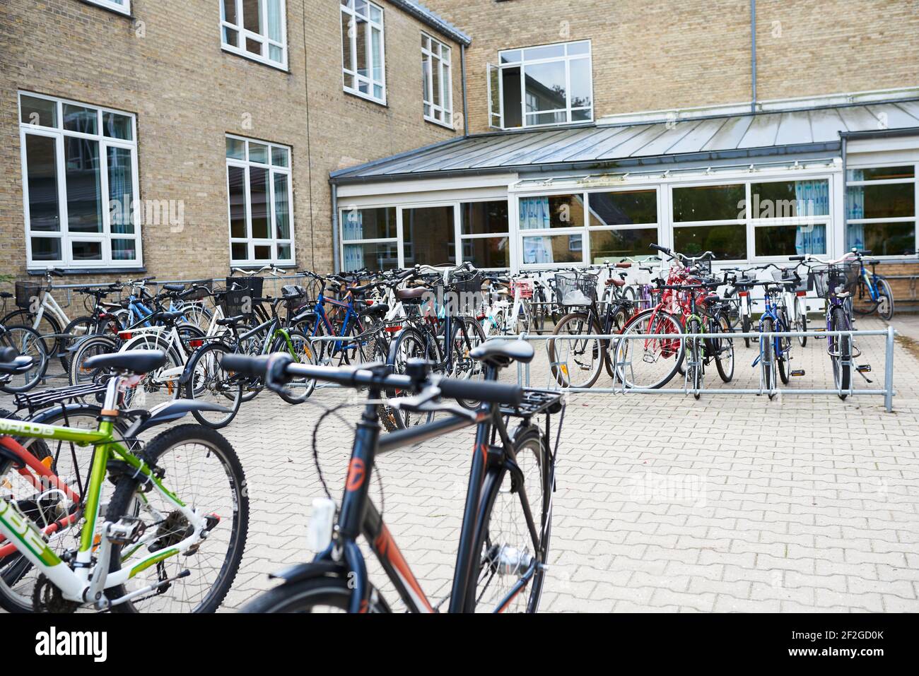 bicycle parking spot at a school yard Stock Photo - Alamy
