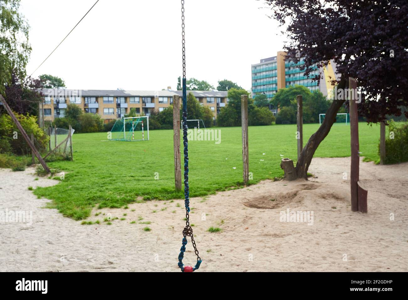 A small cable swing at a park playground for children Stock Photo - Alamy