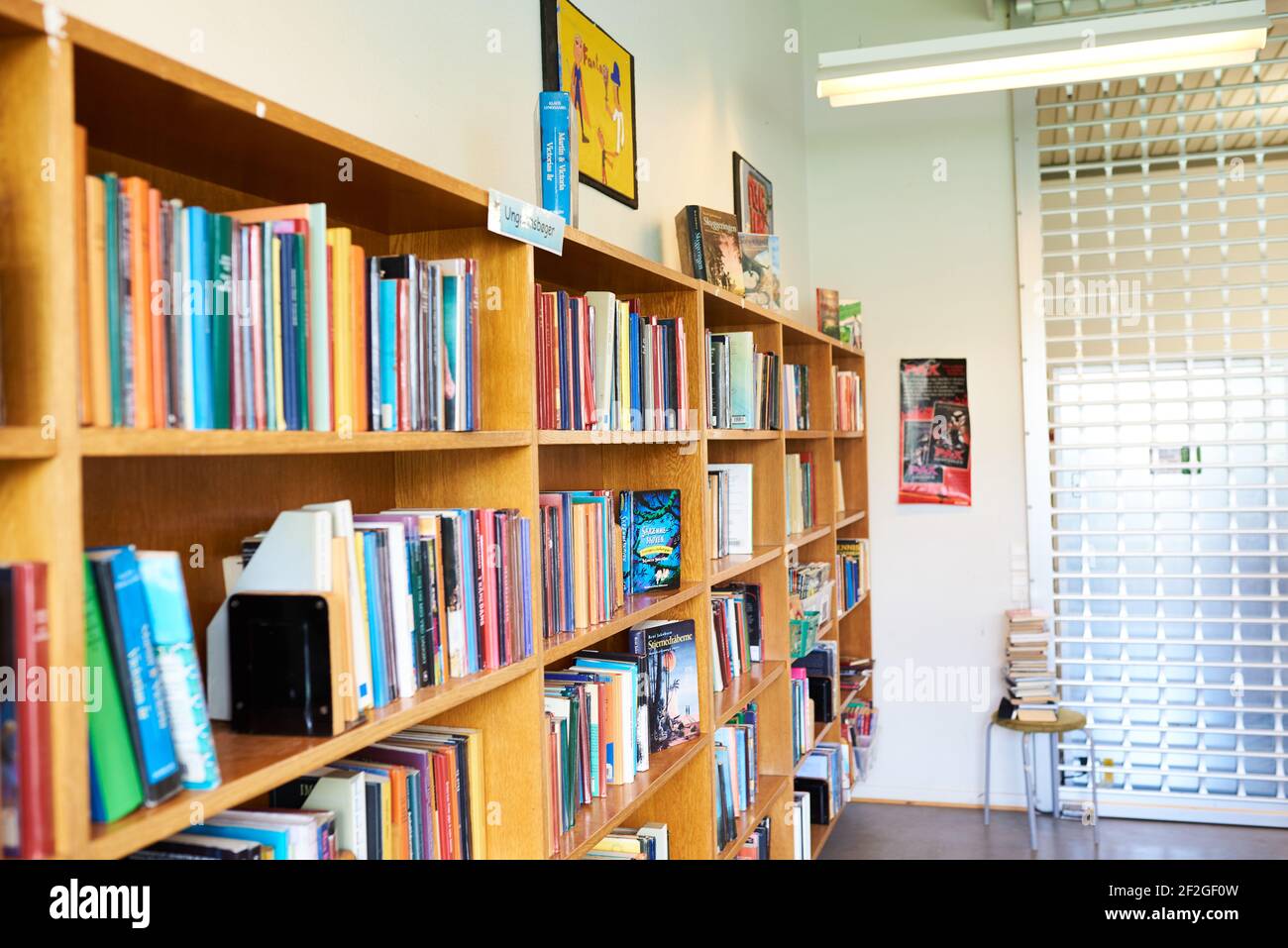 a colorful bookshelf at a school library Stock Photo - Alamy
