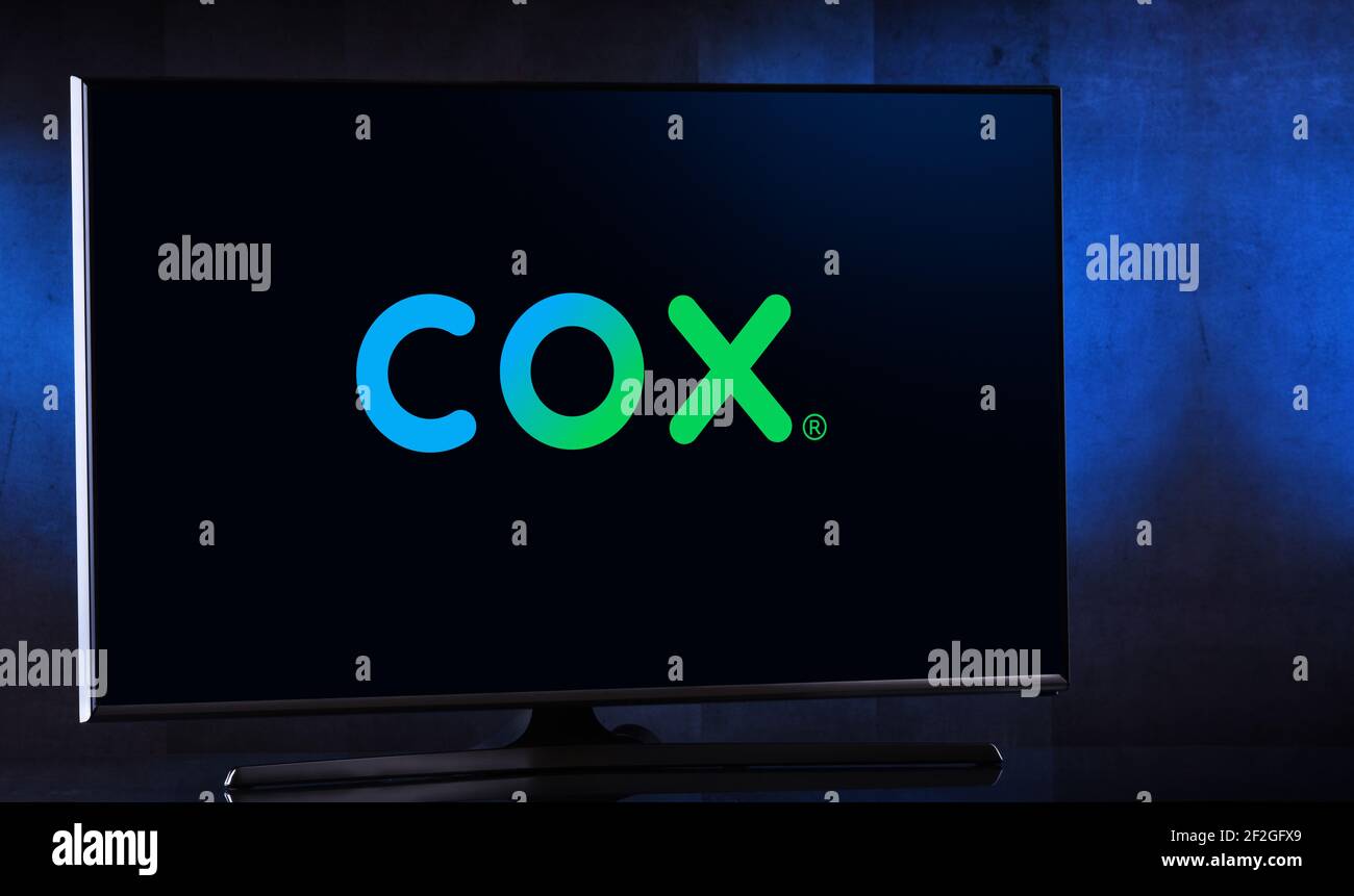POZNAN, POL - FEB 6, 2021: Flat-screen TV set displaying logo of Cox ...
