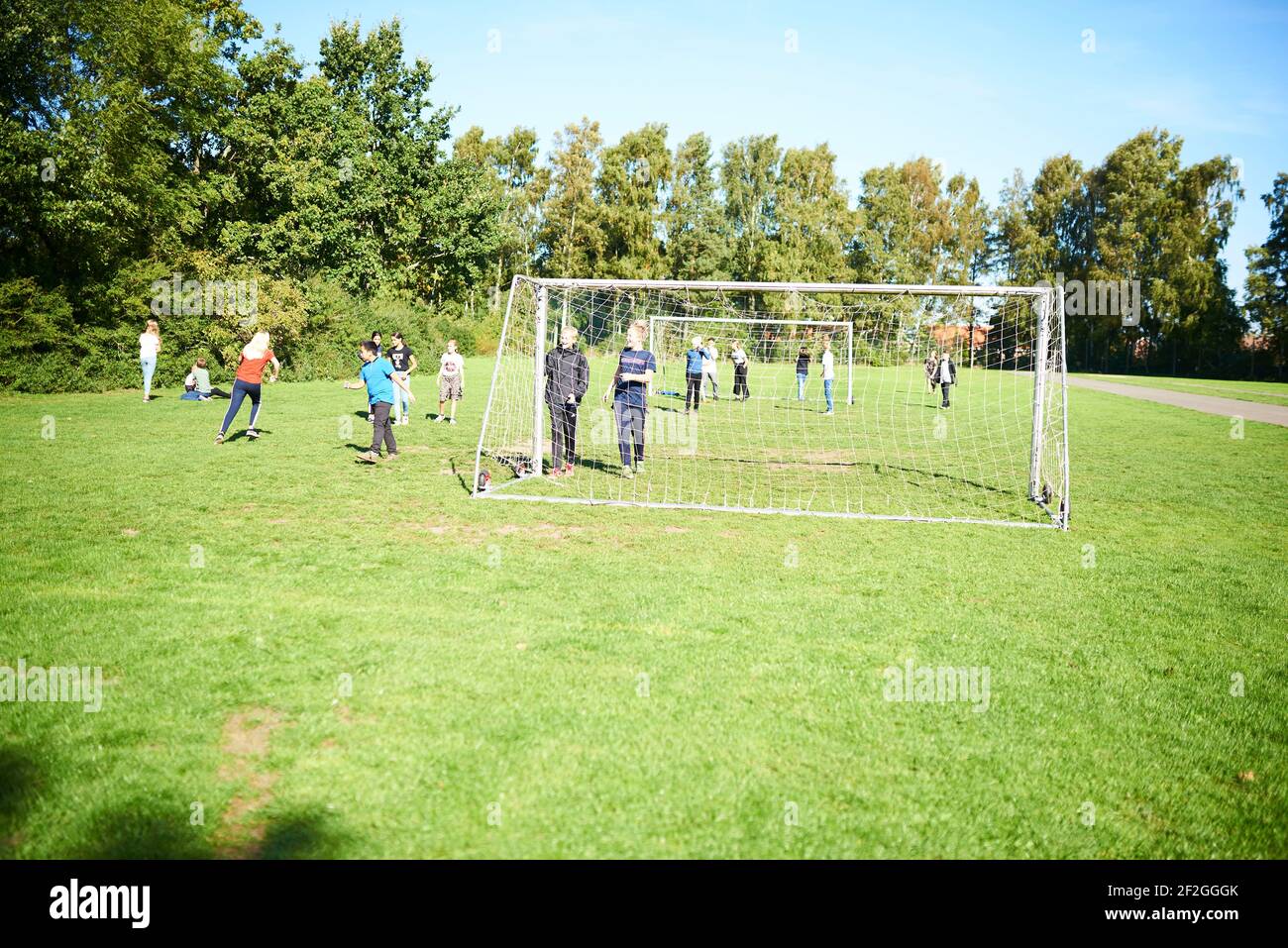 children playing and having fun on a soccer field outdoors Stock Photo ...