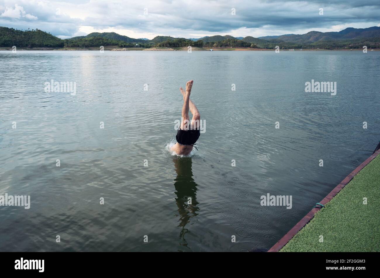 Male diving into lake thailand hi-res stock photography and images - Alamy