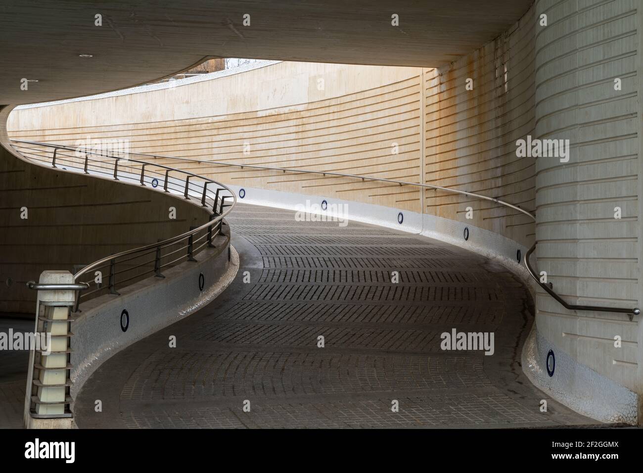 A ramp and underpass under a bridge designed in modern architecture ...