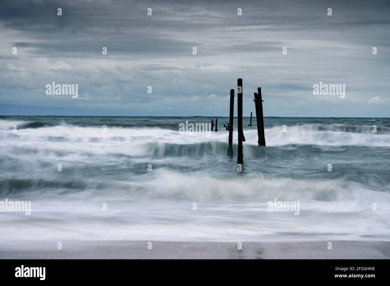Motion of Wave hitting decay wooden bridge on the beach in stormy ...