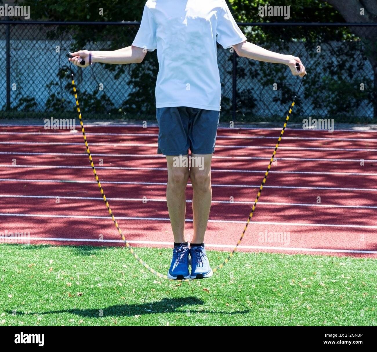 Boy skipping rope hi-res stock photography and images - Alamy