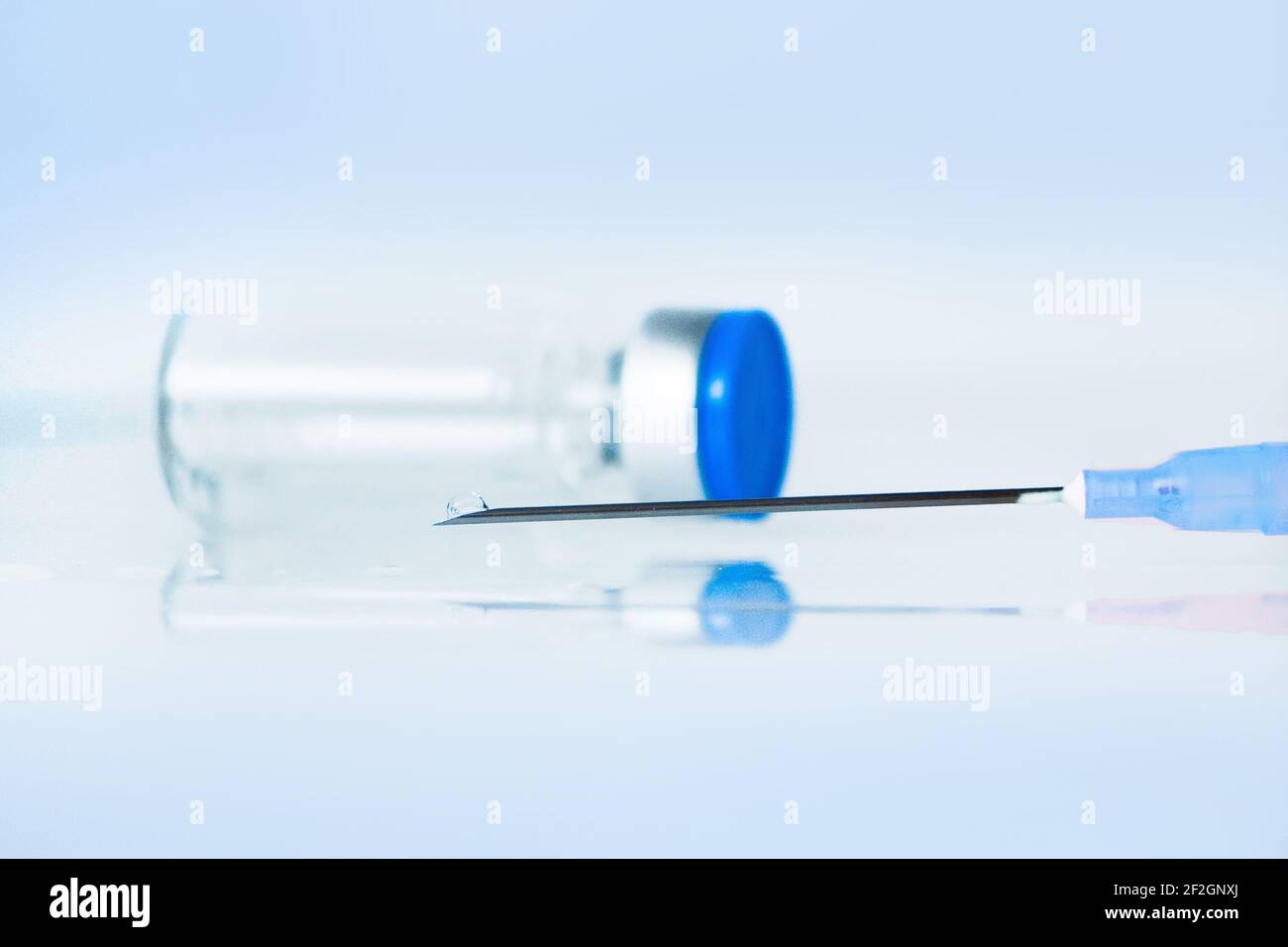 syringe on white background with white background Stock Photo - Alamy