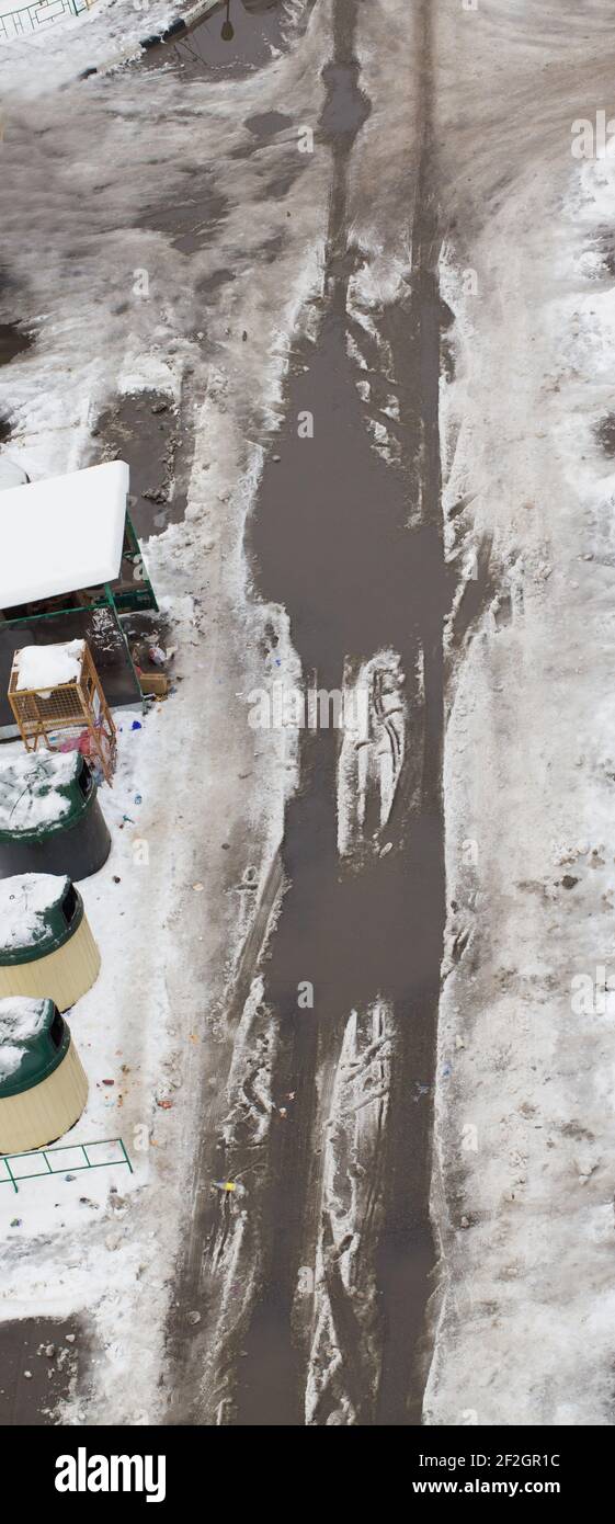 Slush in the city, melted snow. The problem with the shoes. Thaw Stock ...