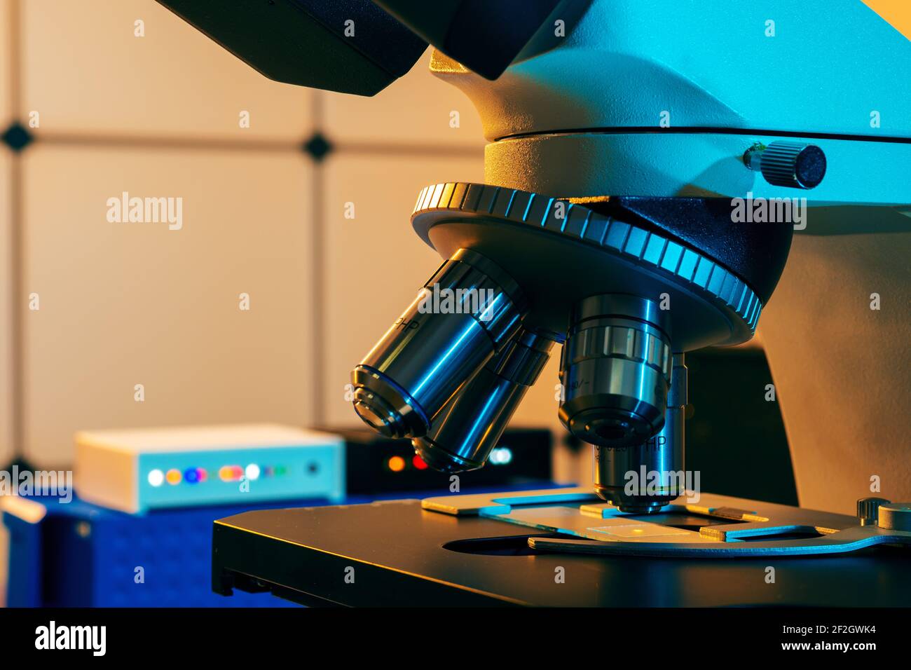 Toned photo of a backlit microscope lens in a science laboratory Stock ...