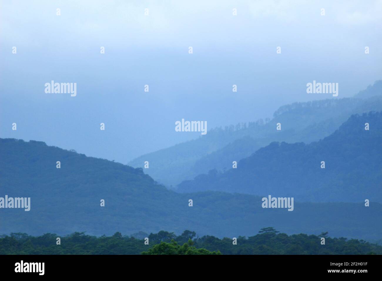 Mountains silhouette with dramatic fog is beautiful background Stock ...