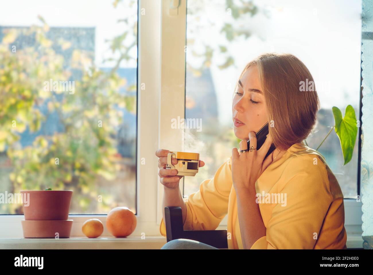 cute girl with a mole on her cheek talking on the phone sitting near ...