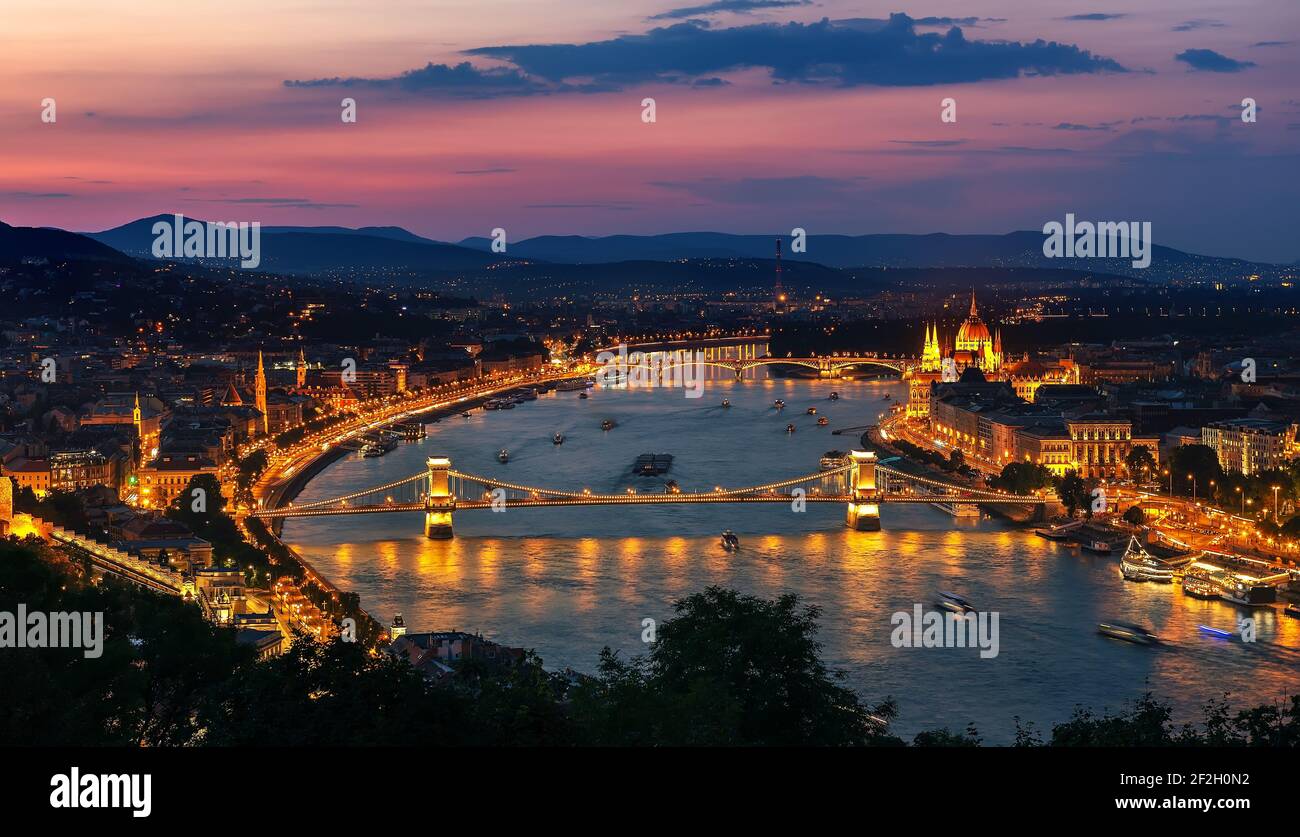Aerial view of Budapest and illuminated landmarks at sunset Stock Photo ...
