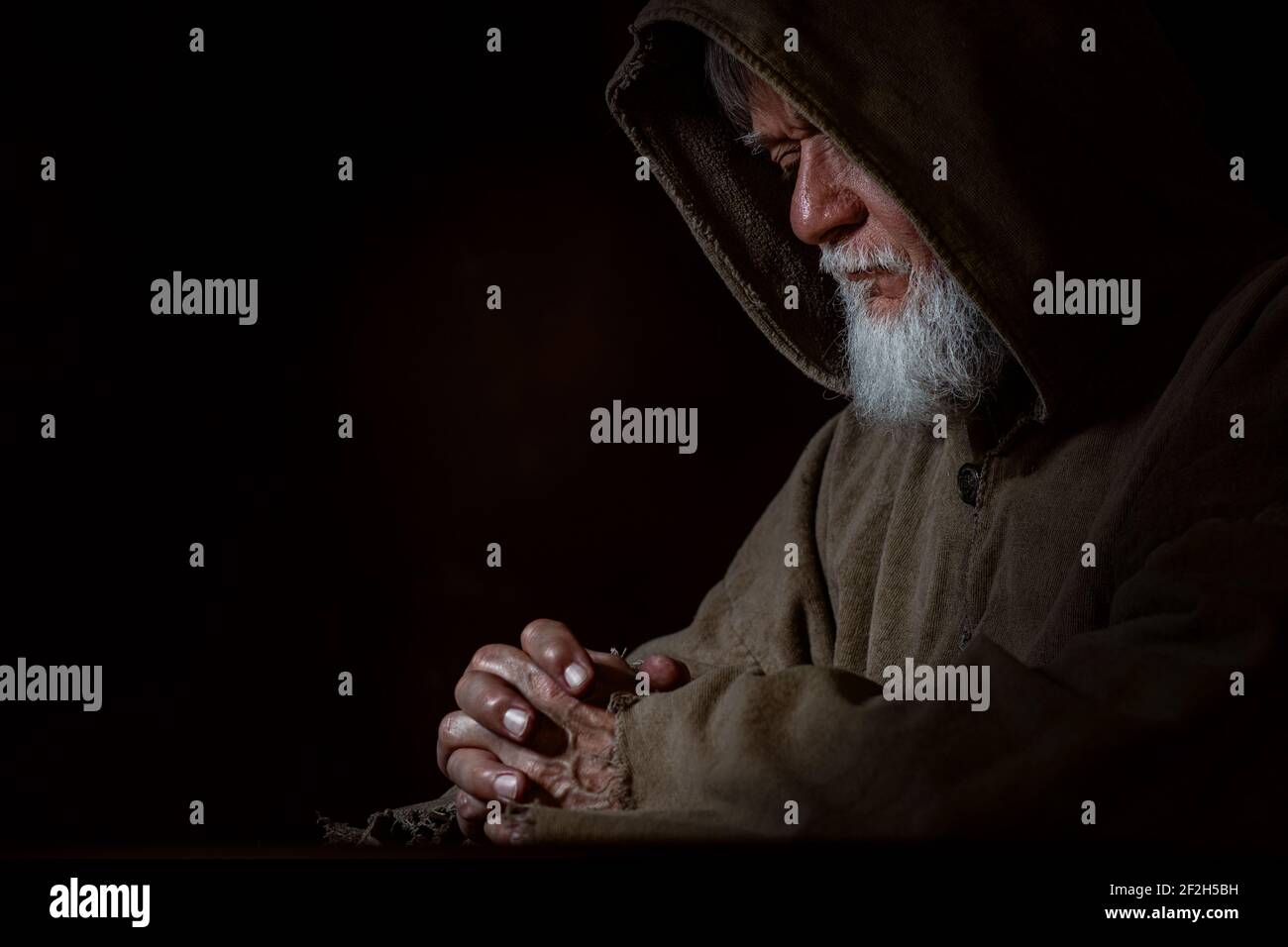 A medieval silent poor prayer Stock Photo - Alamy
