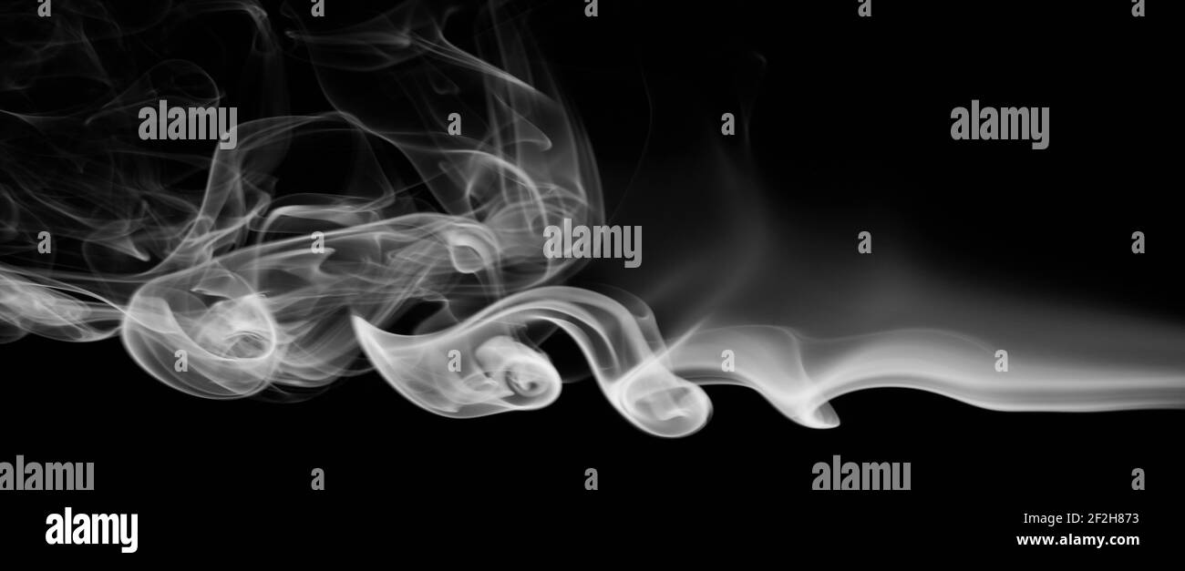 Soft curly smoke swirl isolated on black studio background Stock Photo ...