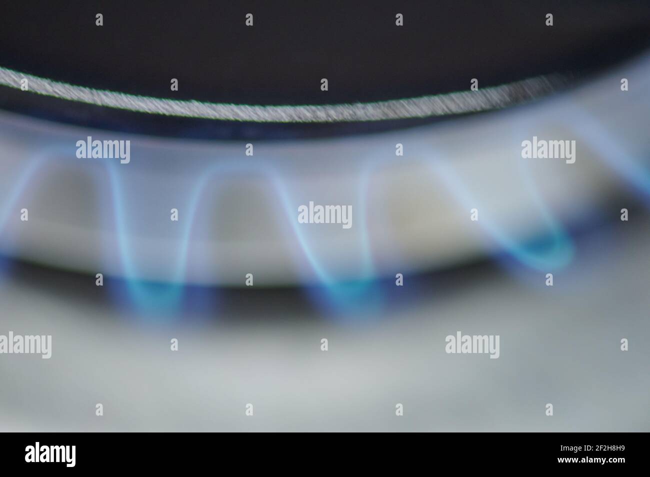 Macro of blue gaz flame on metal background Stock Photo - Alamy