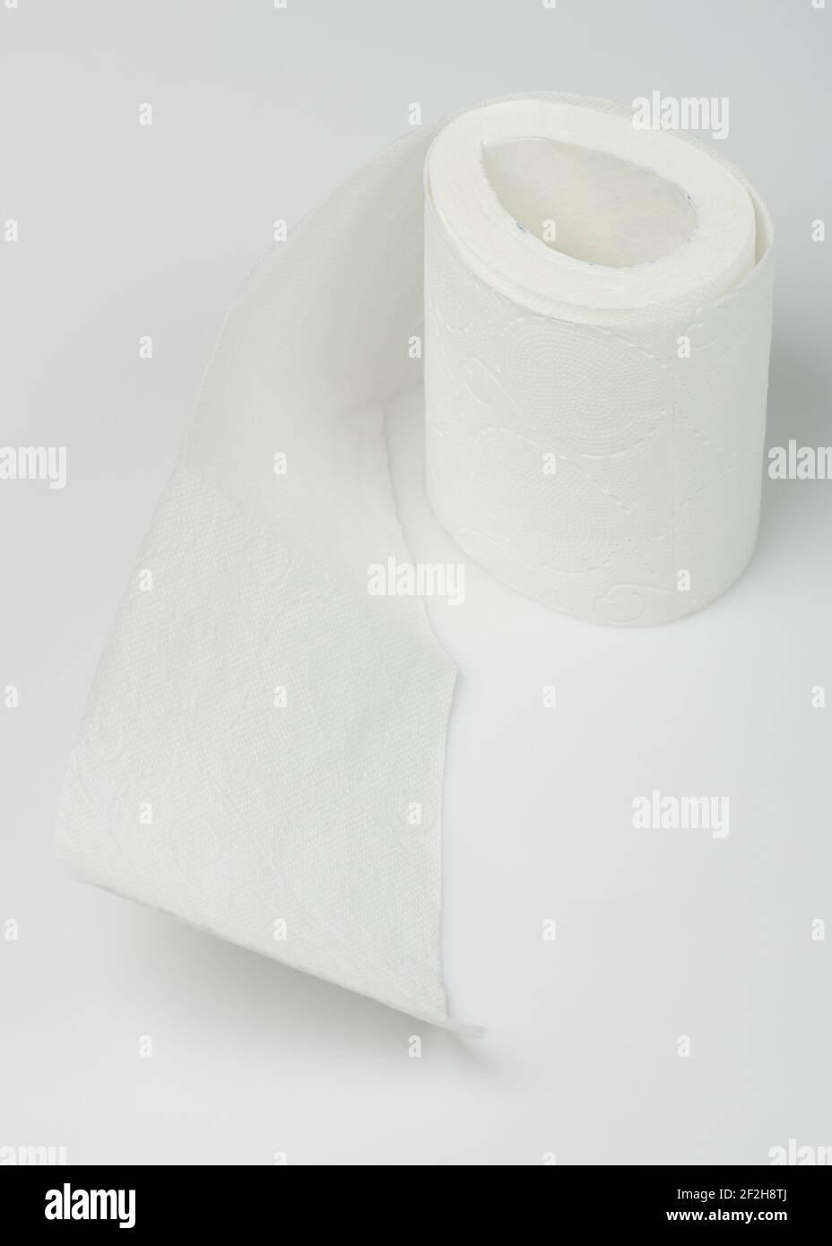 Edge of toilet paper on white studio background Stock Photo - Alamy