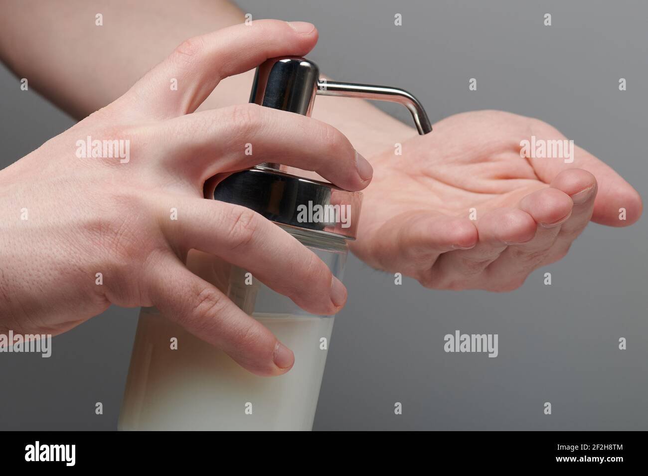 Washing hands theme. Applying liquid soap on hand isolated Stock Photo ...