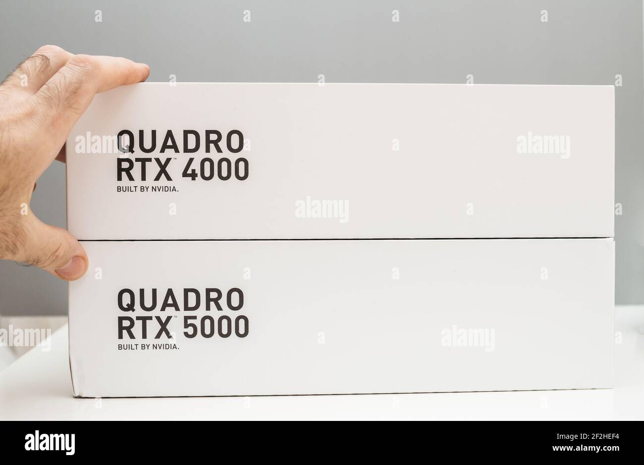 Male hand on the packaging of two new GPU Nvidia Quadro RTX 4000 and ...