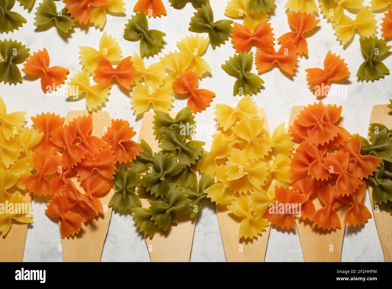 Pasta ties on a marble table Stock Photo - Alamy