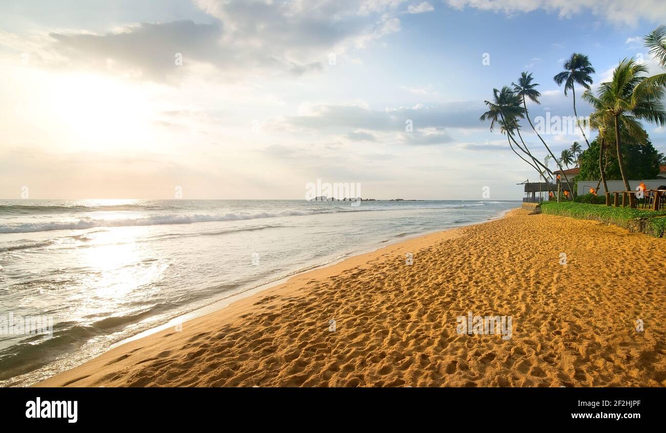 Beautiful evening over the beach of Indian ocean Stock Photo - Alamy