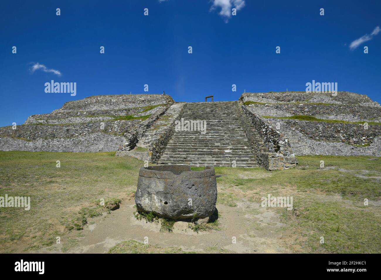 Landscape with view of the Pyramid of Flowers behind a monolithic basin ...
