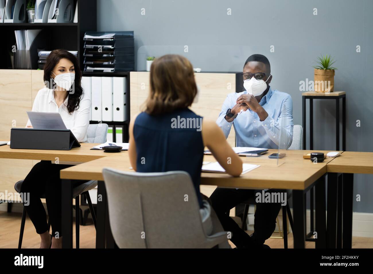 Business Manager Job Interview Talking In Face Mask Stock Photo - Alamy