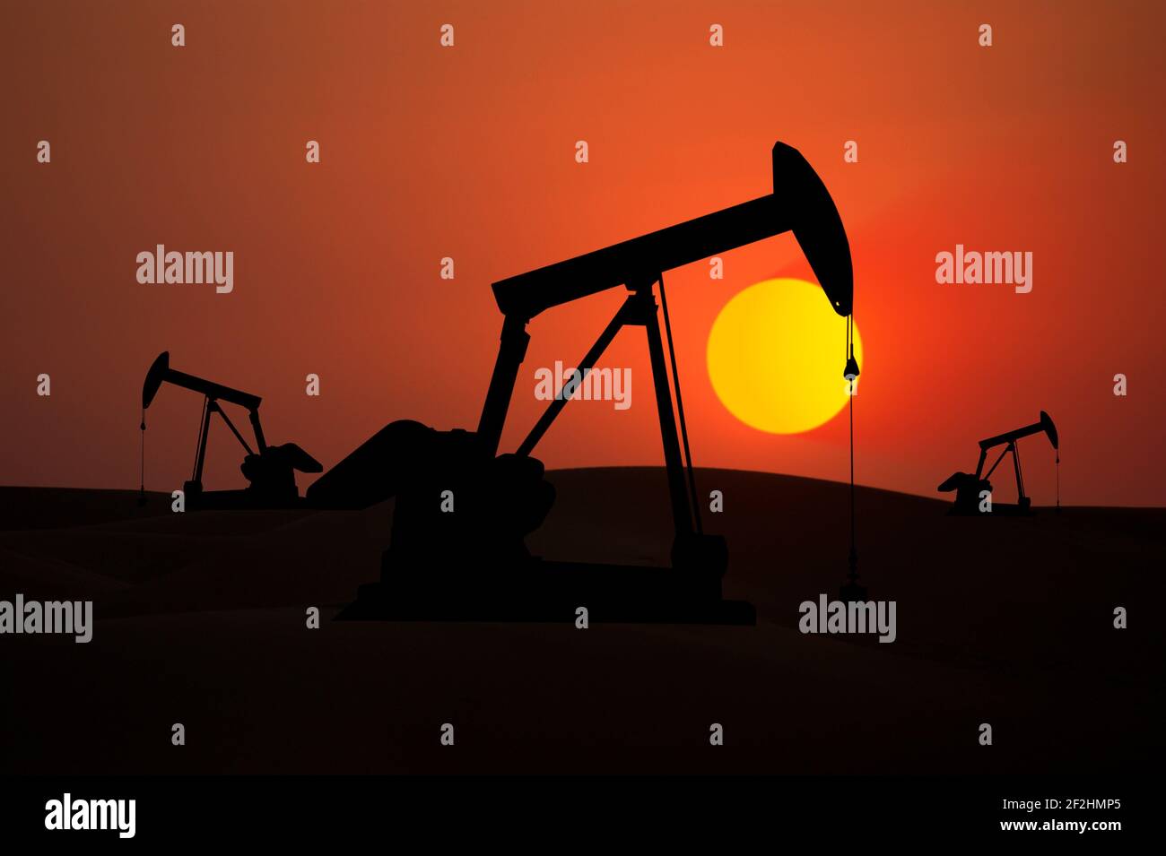 Oil pumps with sunset background Stock Photo - Alamy