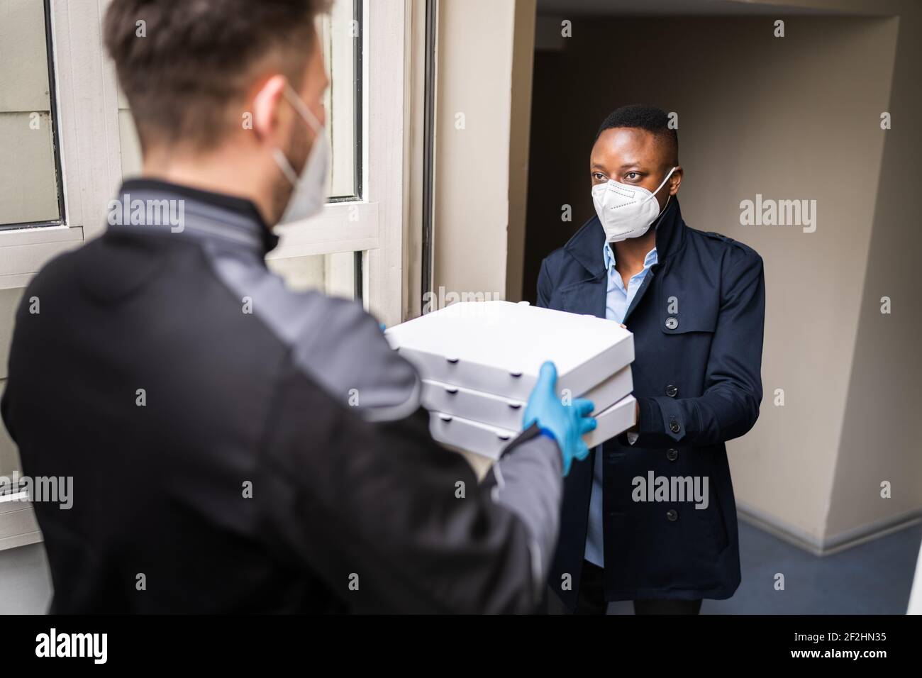 African courier delivering pizza hi-res stock photography and images ...