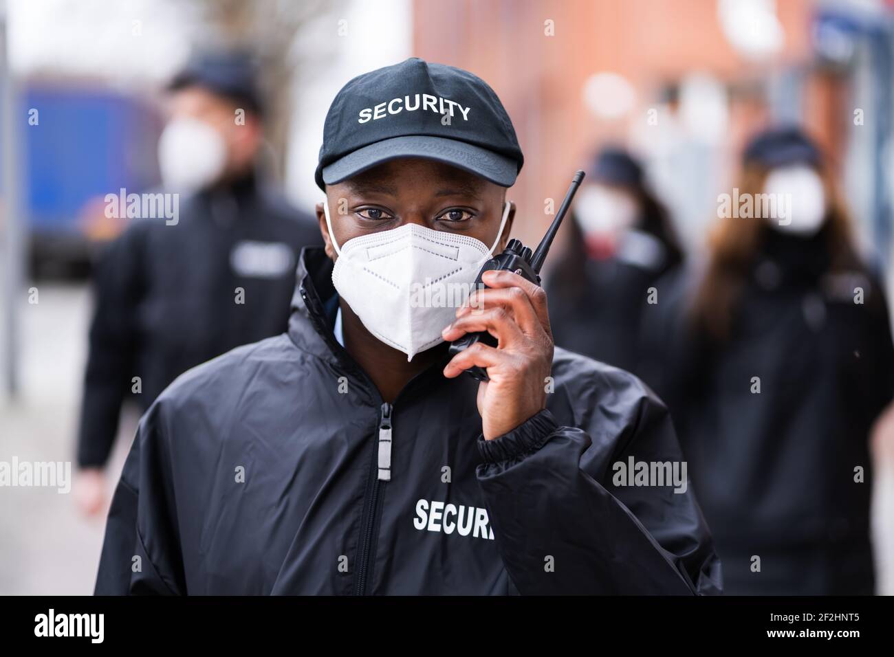 Security Officer Staff Group At Event In Face Mask Stock Photo - Alamy
