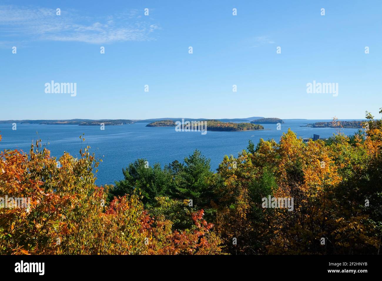 Looking out at islands in Frenchman's Bay during autumn, fall color ...