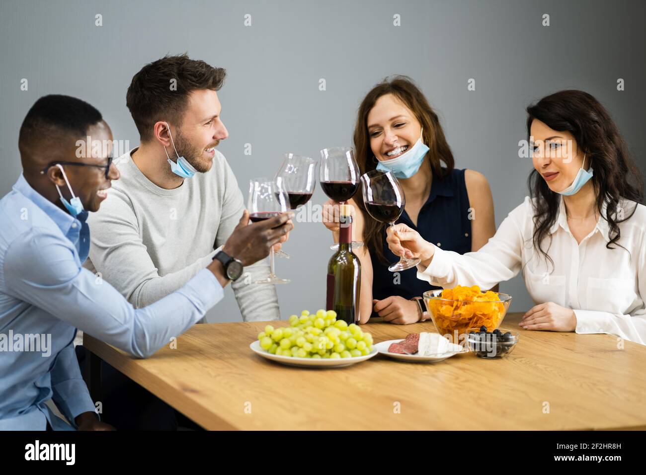 Fun People Food Party. Friends Having Dinner Stock Photo - Alamy