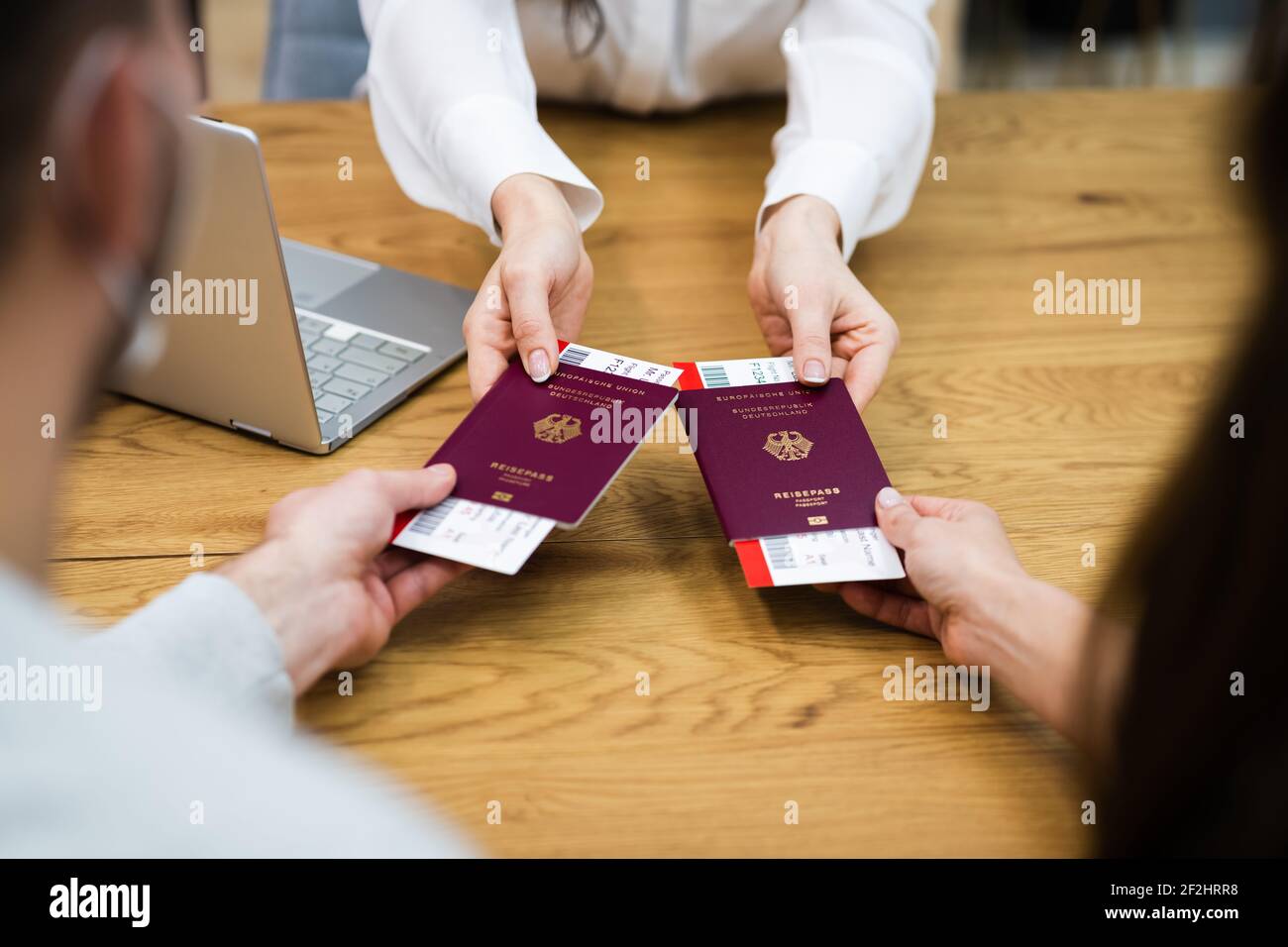 Couple Family Booking Cruise Ticket At Travel Agent Stock Photo - Alamy