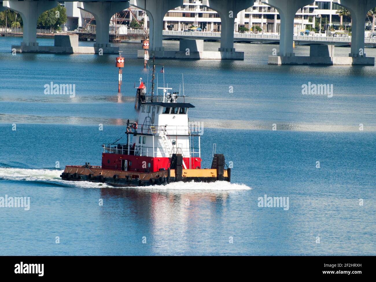 The red color tugboat passing by in Miami downtown harbor (Florida ...