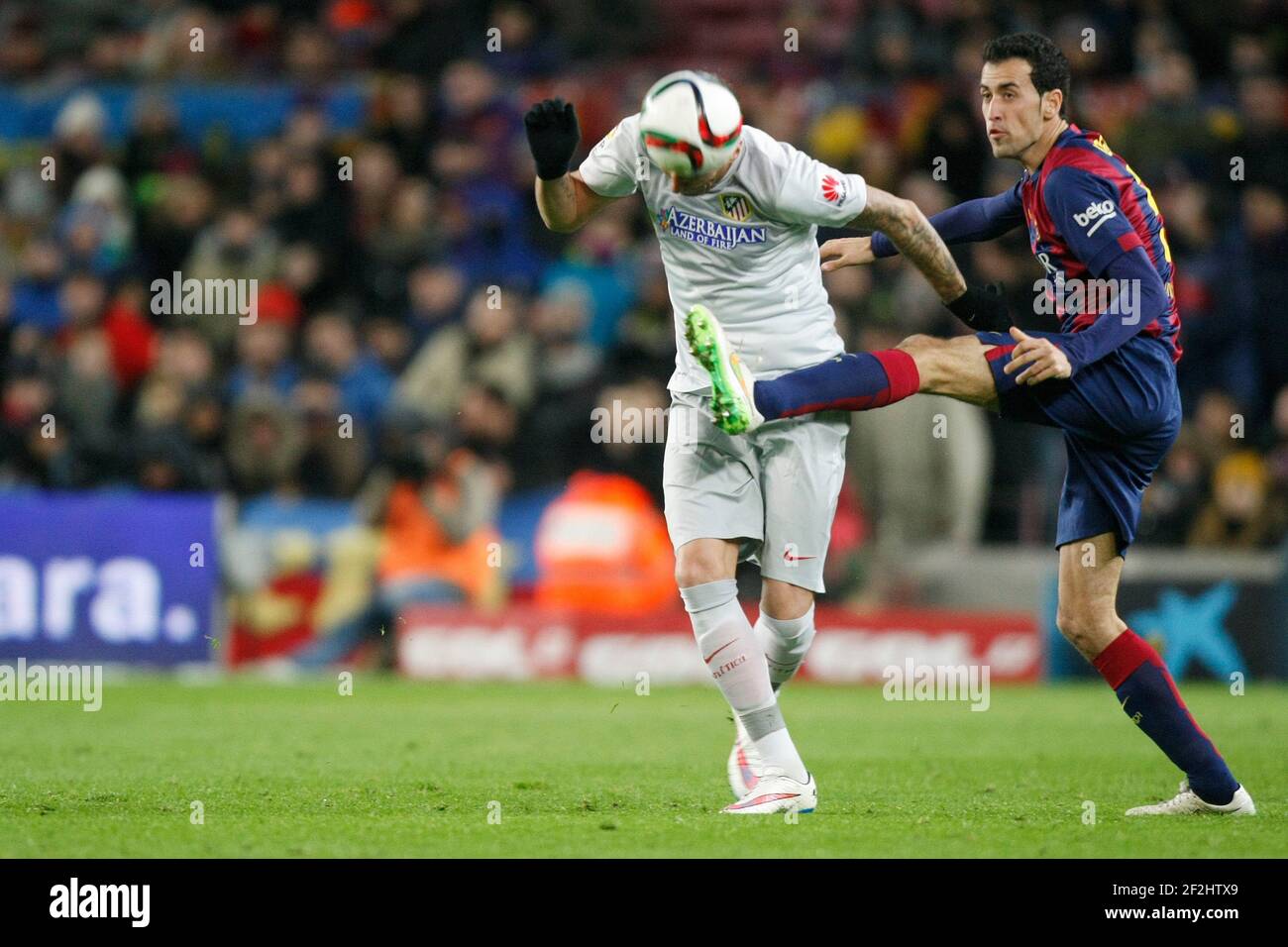 Sergio Busquets of Barcelona and Mario Mandzukic of Atletico during the ...