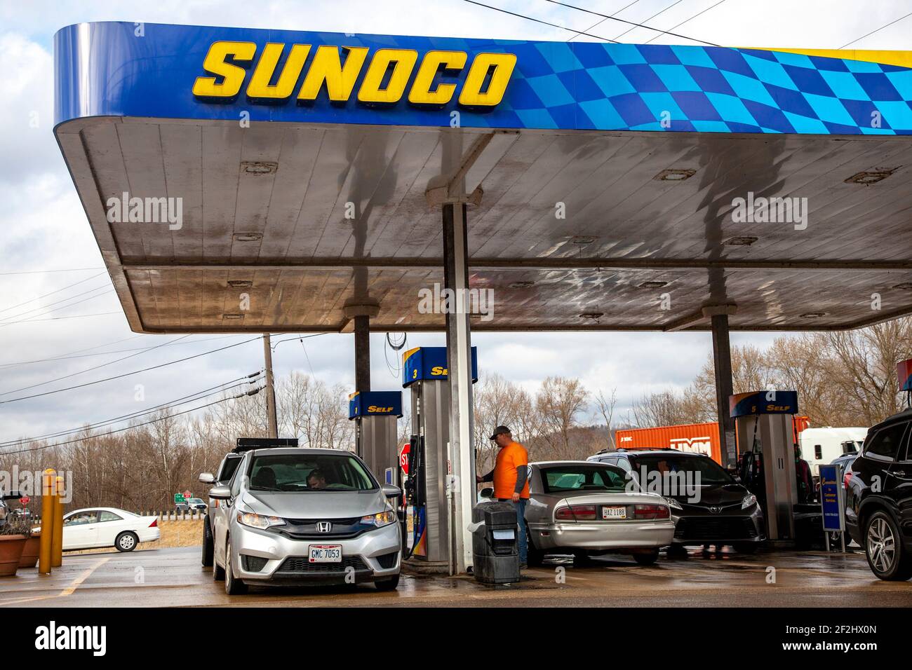 Patrons of Sunoco gas station off of route 33 fuel up. (Photo by ...
