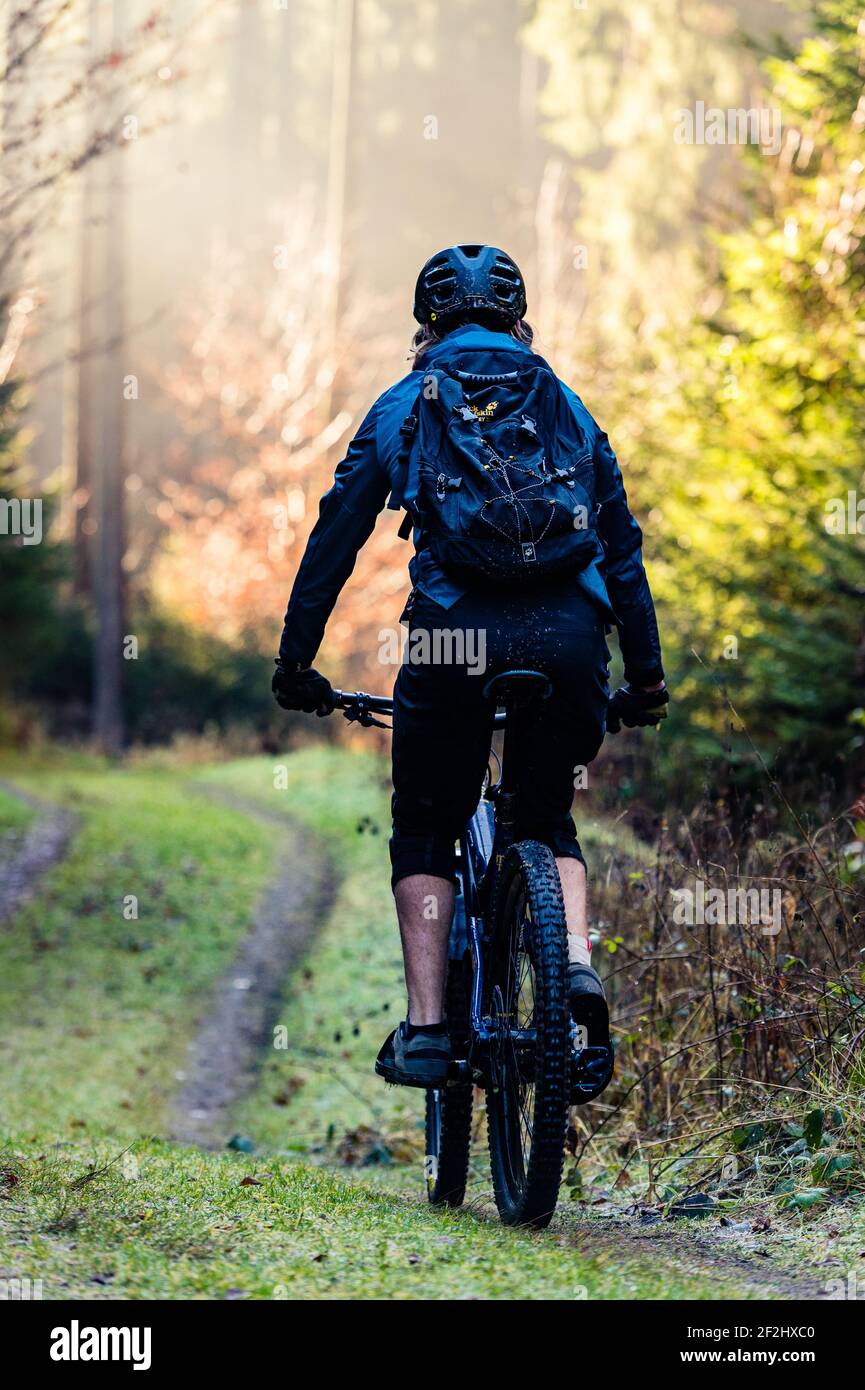 Person riding mountainbike hi-res stock photography and images - Alamy