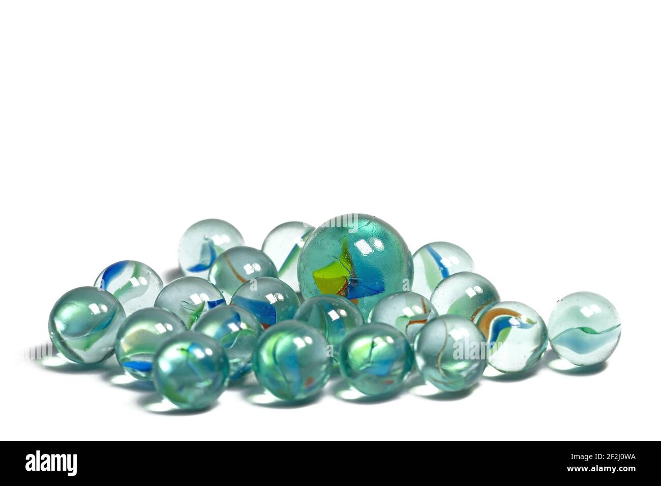 Lots of colorful glass balls against a white background Stock Photo - Alamy