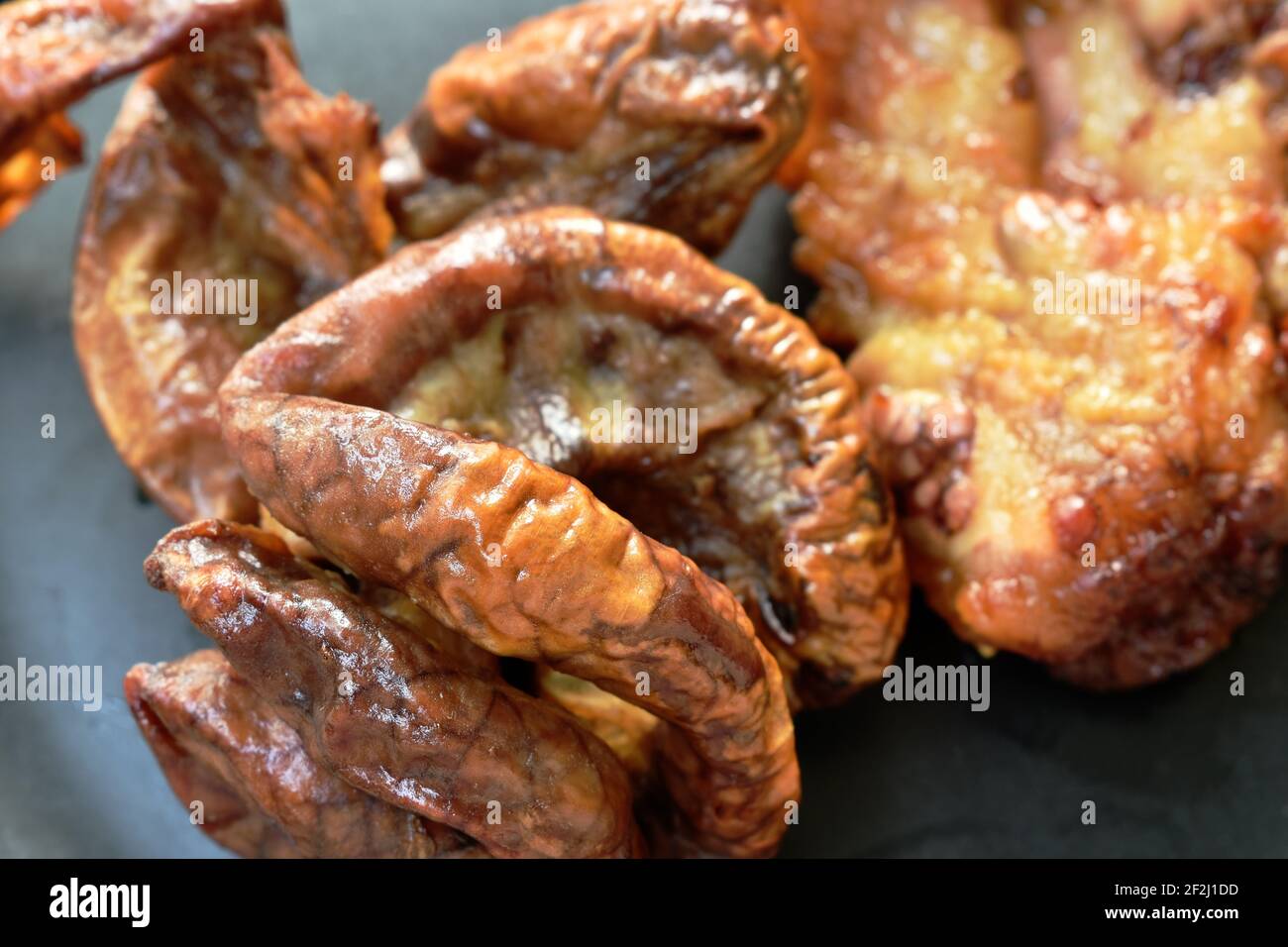 roasted pork neck and innards on plate dipping with tamarind sauce ...