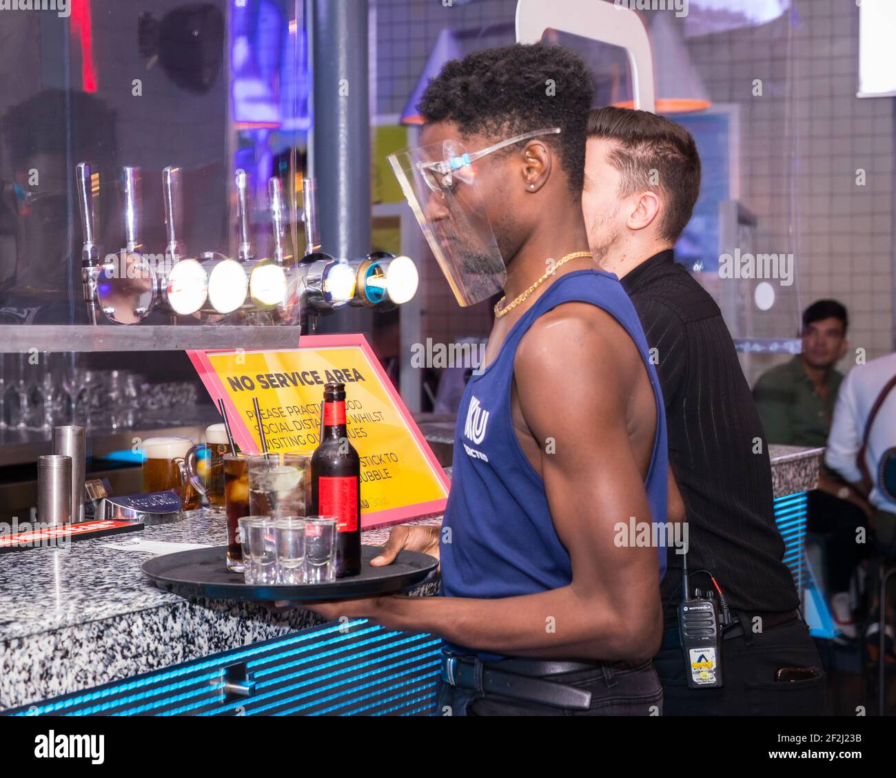 bar staff at socially distanced bar in London Stock Photo - Alamy
