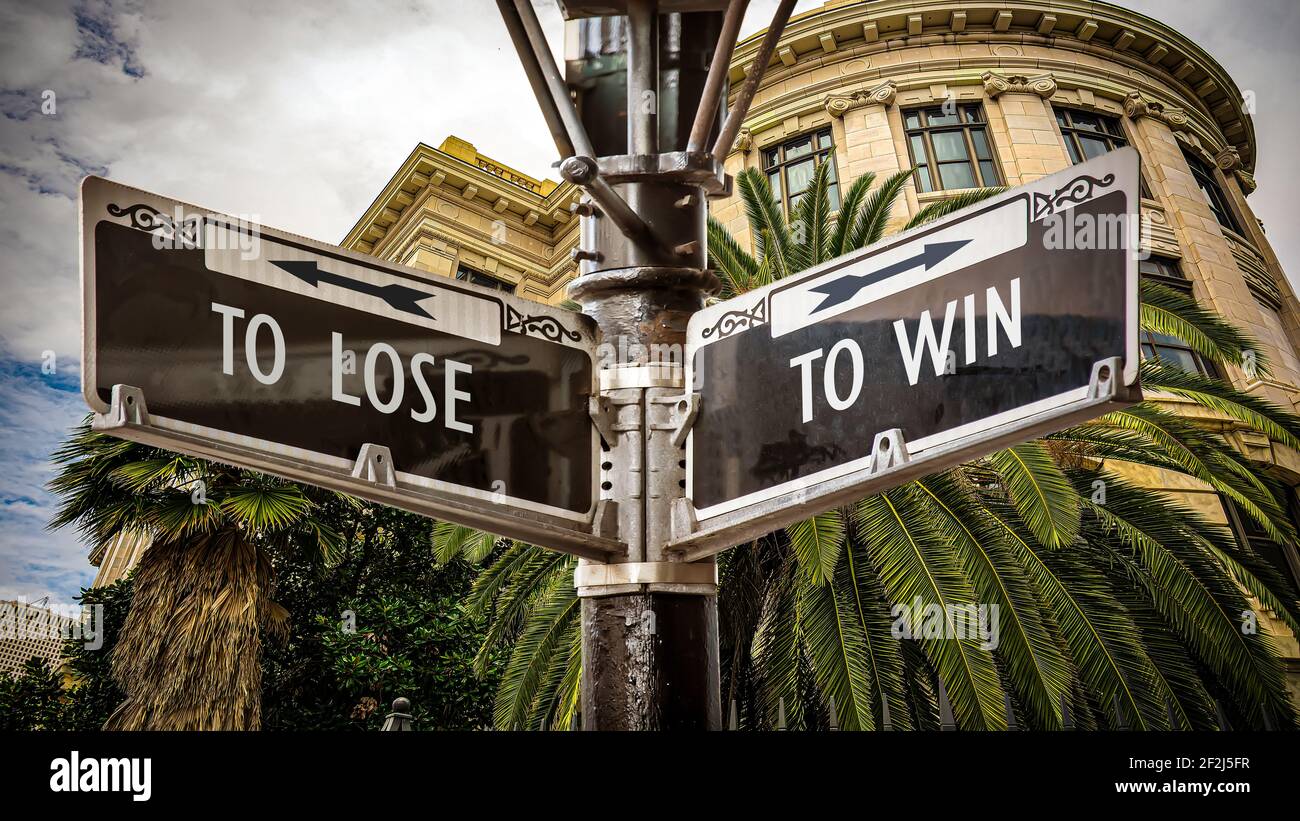 Street Sign the Direction Way TO WIN versus TO LOSE Stock Photo - Alamy