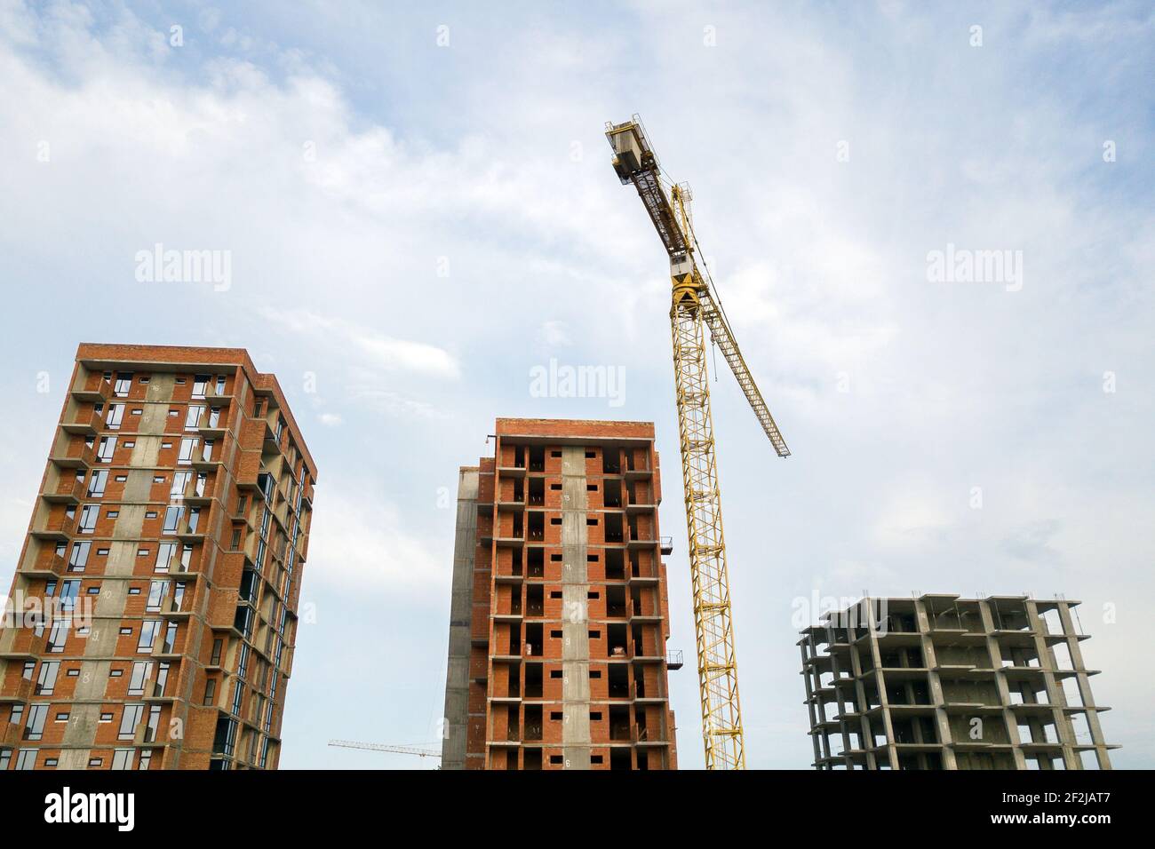 High-rise residential apartment buildings and tower crane under ...