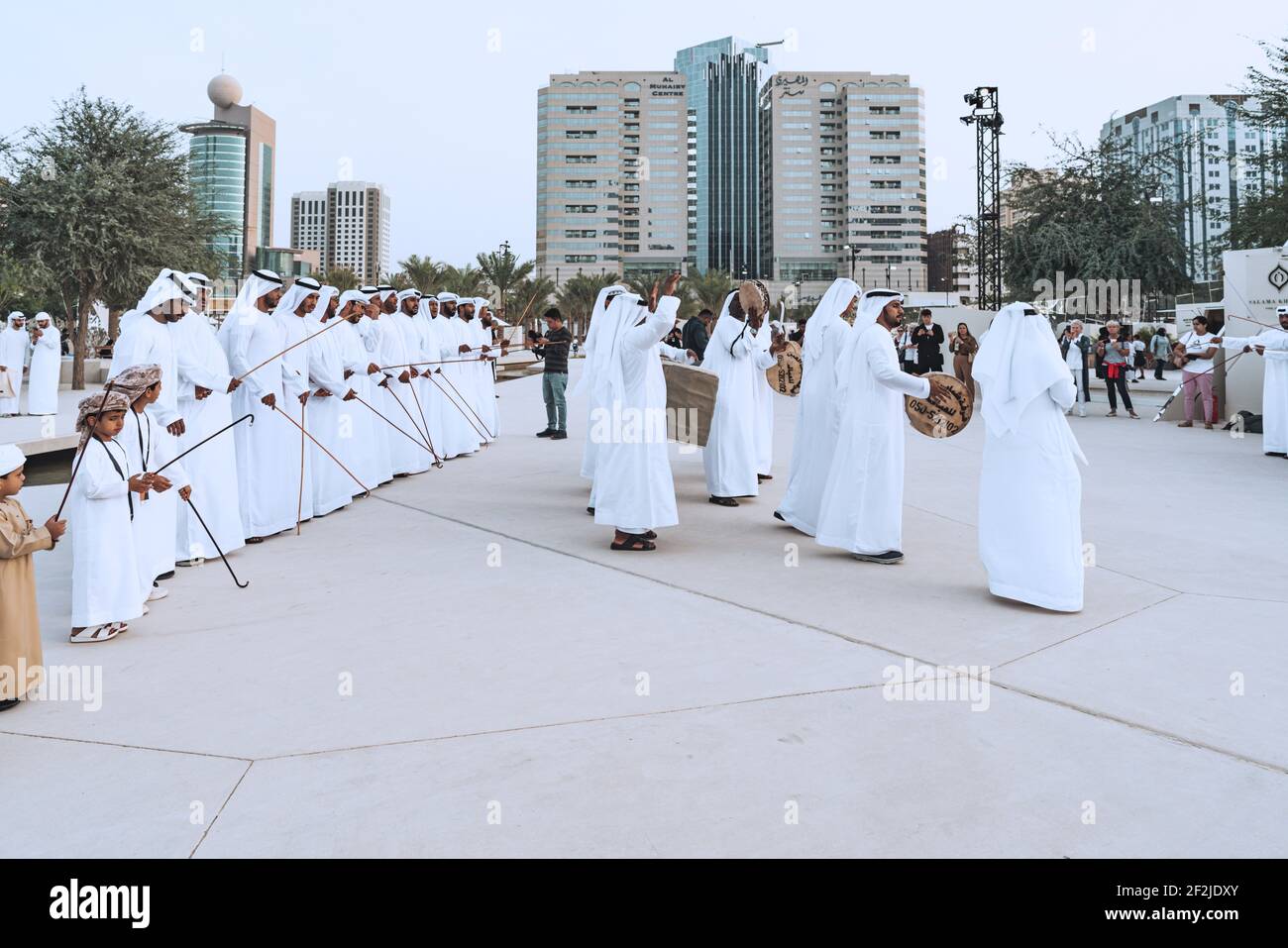 Middle Eastern Culture - Emirati Men performing Al Ayala traditional ...