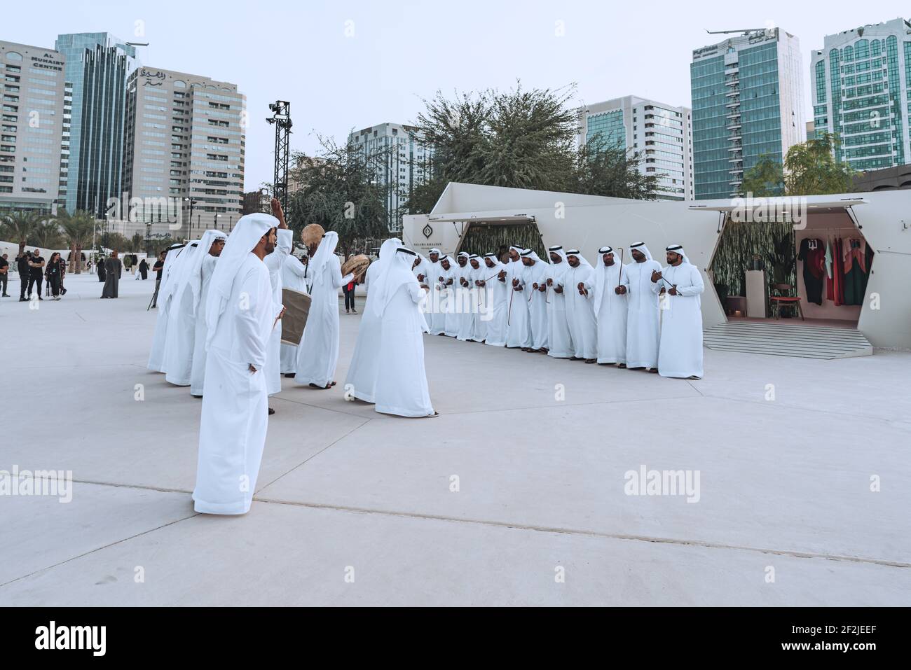 Middle Eastern Culture - Emirati Men performing Al Ayala traditional ...