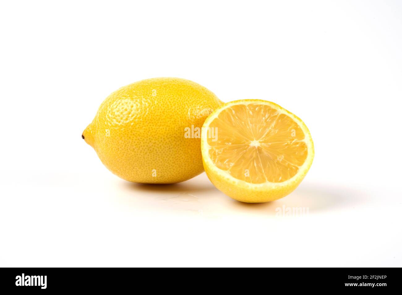 A whole and half lemons isolated on white background Stock Photo - Alamy