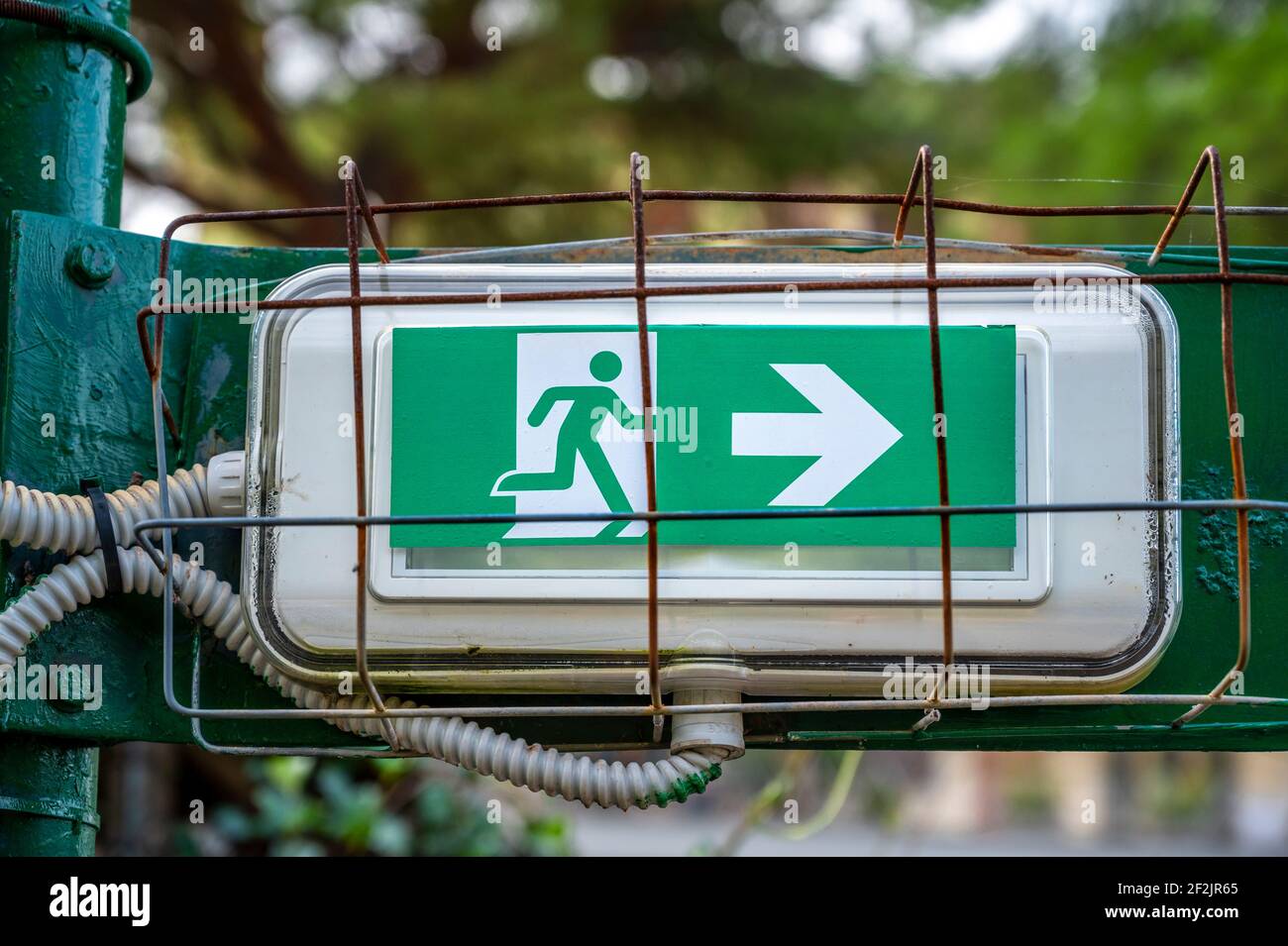 Emergency exit signage outdoors Stock Photo - Alamy
