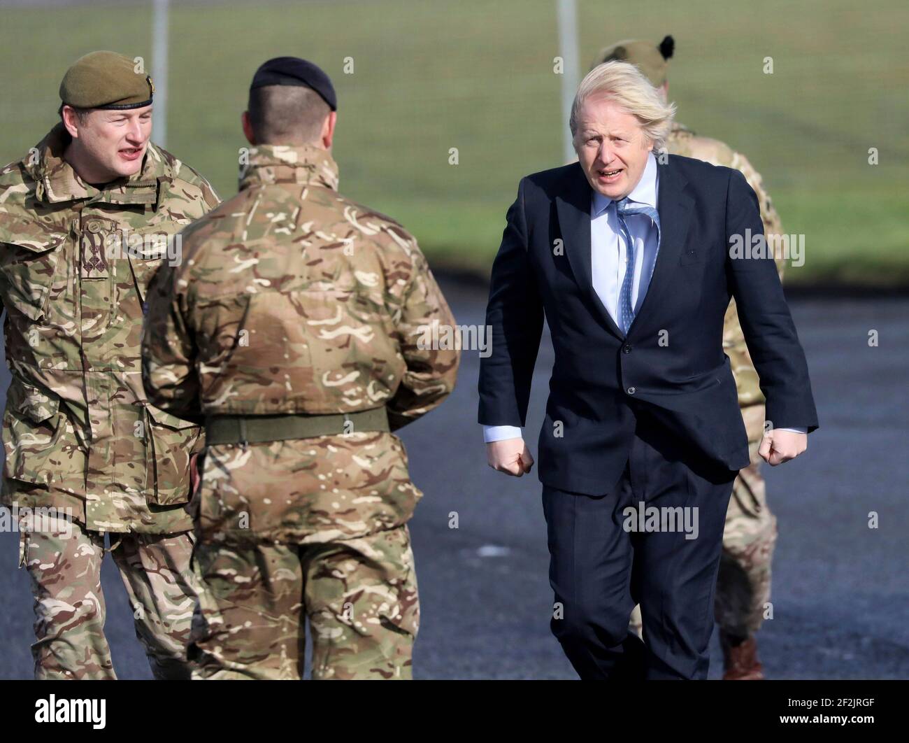 Prime Minister Boris Johnson greets troops alongside Brigadier Chris ...