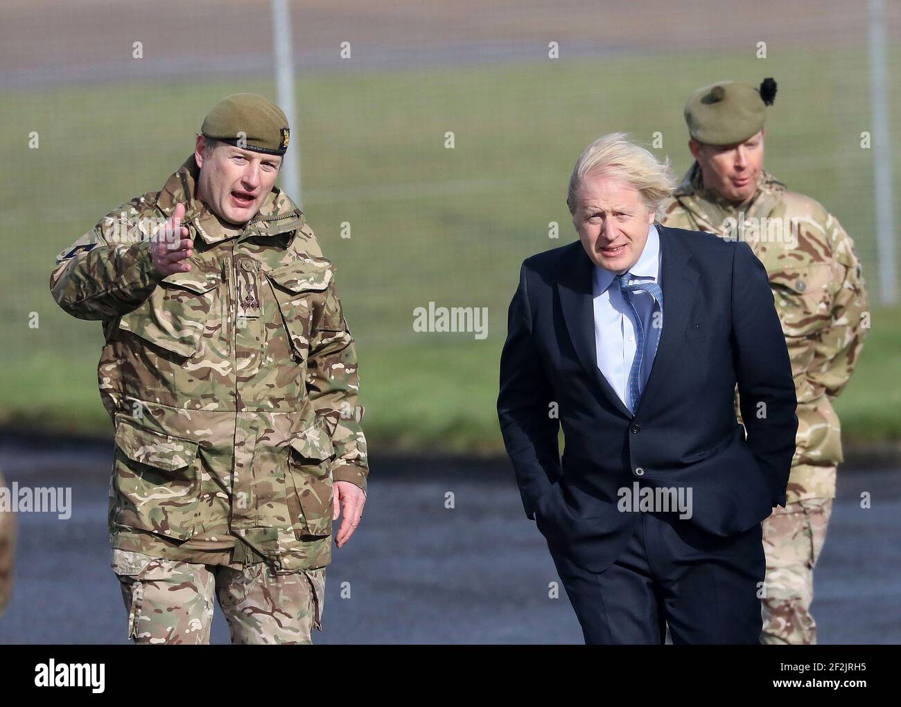 Prime Minister Boris Johnson is greeted by Brigadier Chris Davies ...